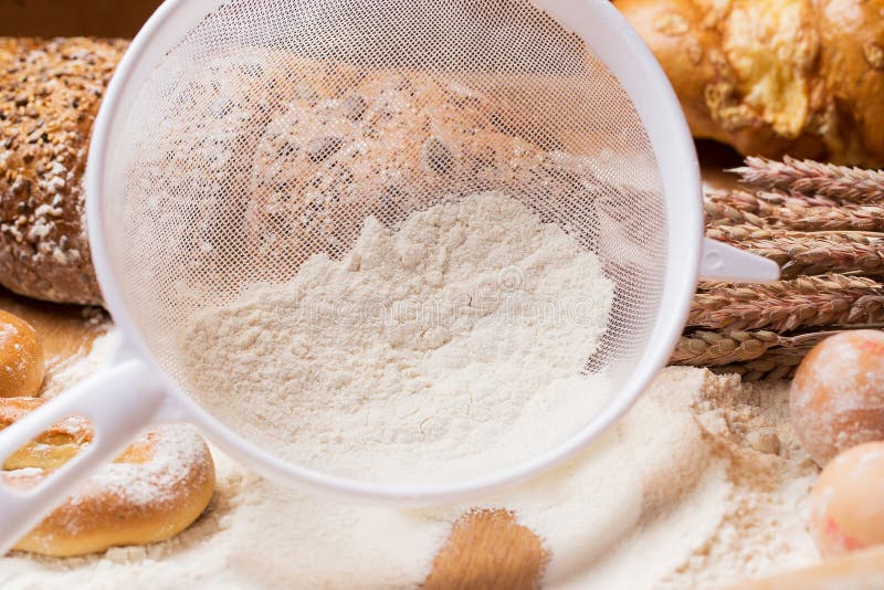 Cooking. White Sieve with Flour and Bread Stock Photo - Image of grains ...