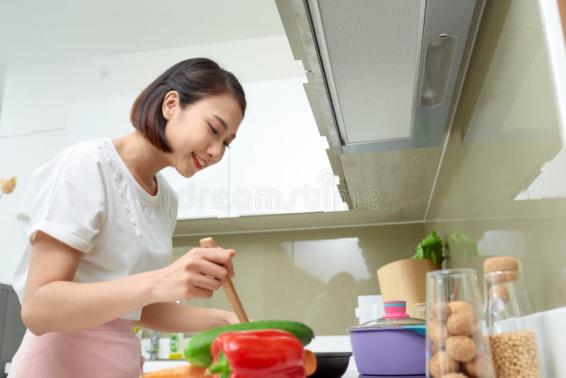 Cooking Woman in Kitchen with Wooden Spoon Stock Photo - Image of smile ...