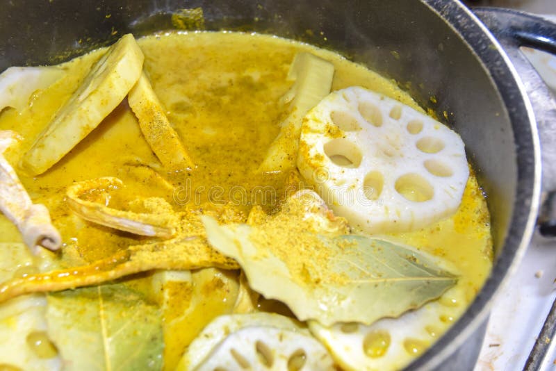 Cooking Yellow Green Curry with Lotus Root and Spices Stock Image ...