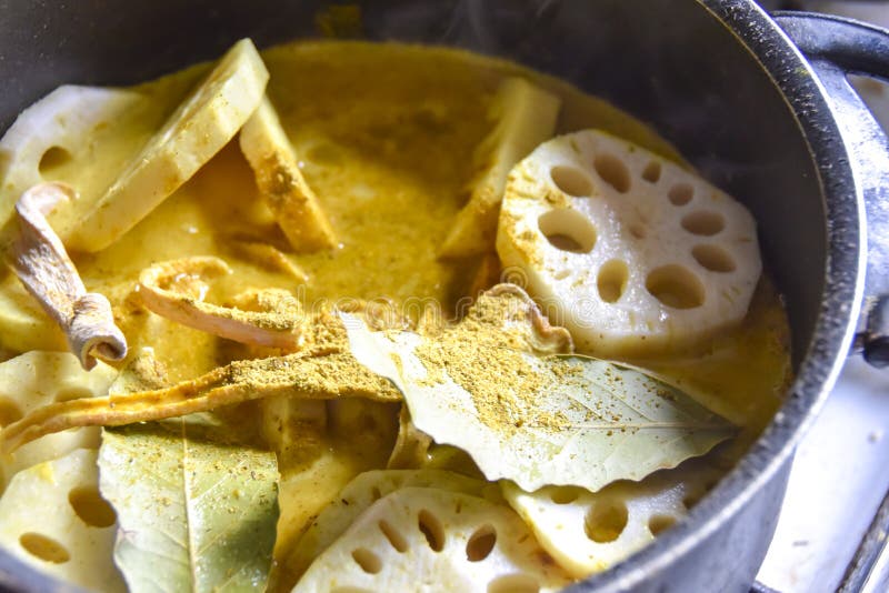 Cooking Yellow Green Curry with Lotus Root and Spices Stock Photo ...