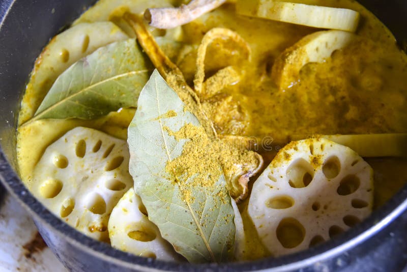 Cooking Yellow Green Curry with Lotus Root and Spices Stock Photo ...