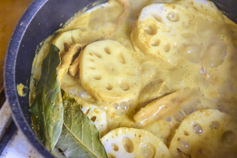 Cooking Yellow Green Curry with Lotus Root and Spices Stock Image ...