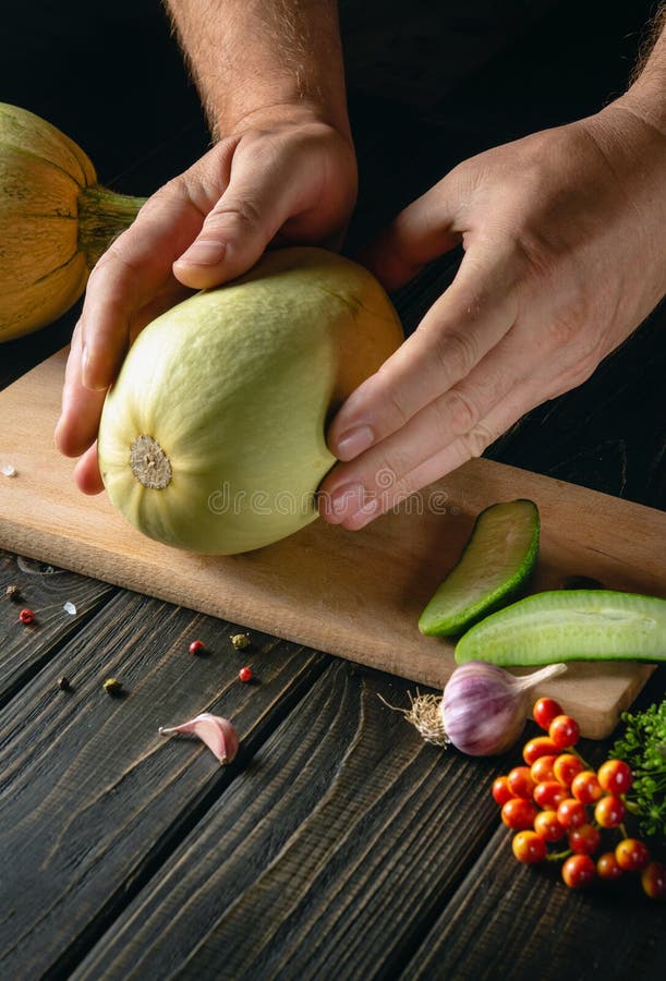Cooking Zucchini by the Hands of the Chef in the Kitchen. in Cooking ...