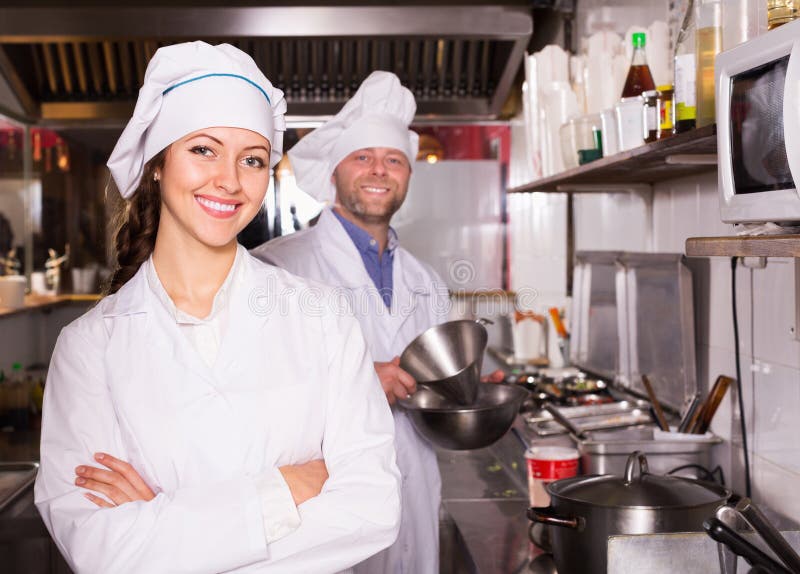 Cooks Greeting Customers at Bistro Stock Photo - Image of male, casual ...