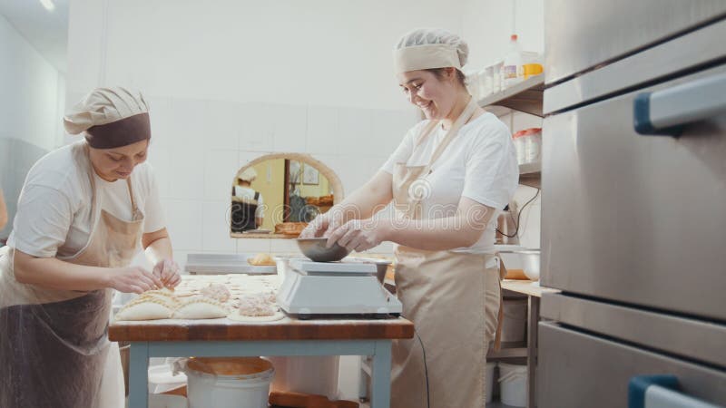 Cooks on the Kitchen is Making Bakery Products by Hands, in Full Growth ...
