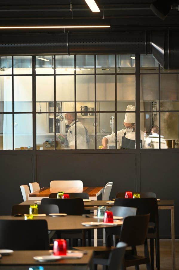 Cooks at Work in the Open Kitchen of a Restaurant before Opening To ...