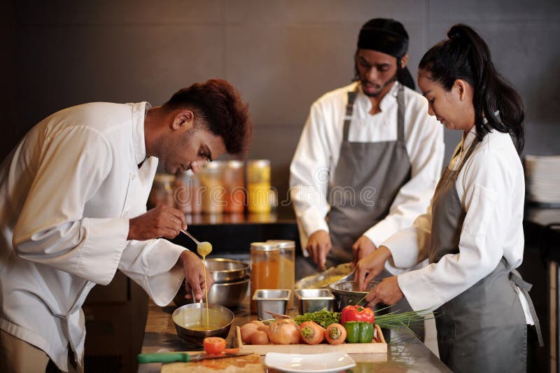 Cooks Working in Kitchen stock image. Image of teamwork - 287237195