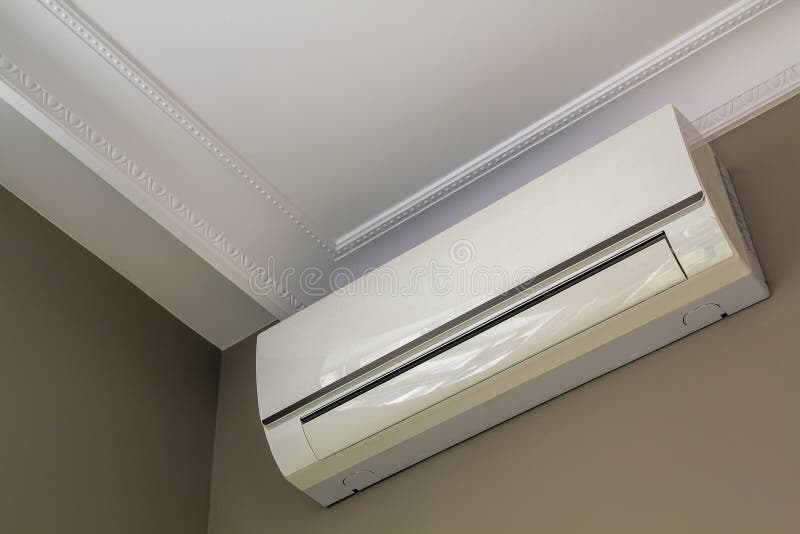 Cool Air Conditioner Installed in Room Interior on White Ceiling and ...