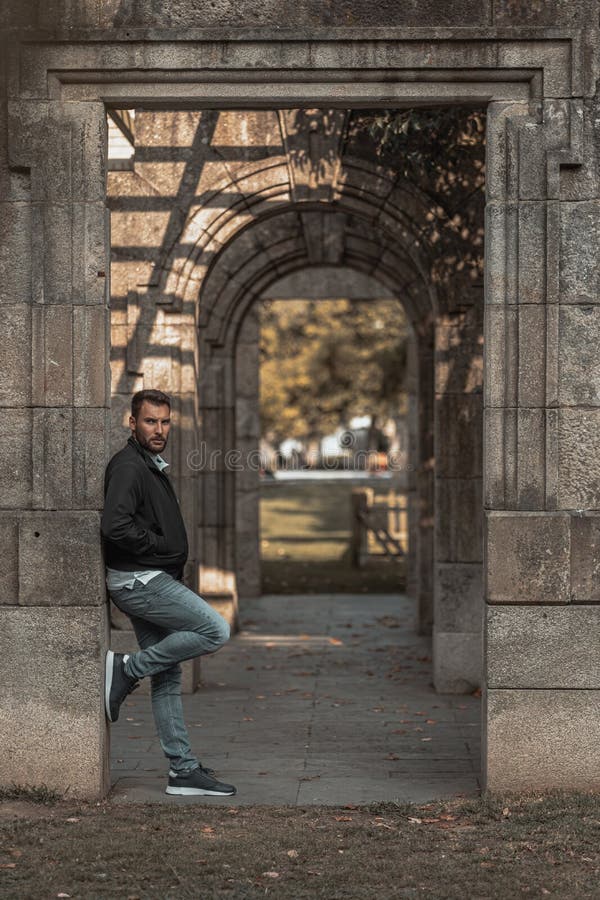 Cool and Attractive Slovenian Man Standing between the Old Arch of a ...