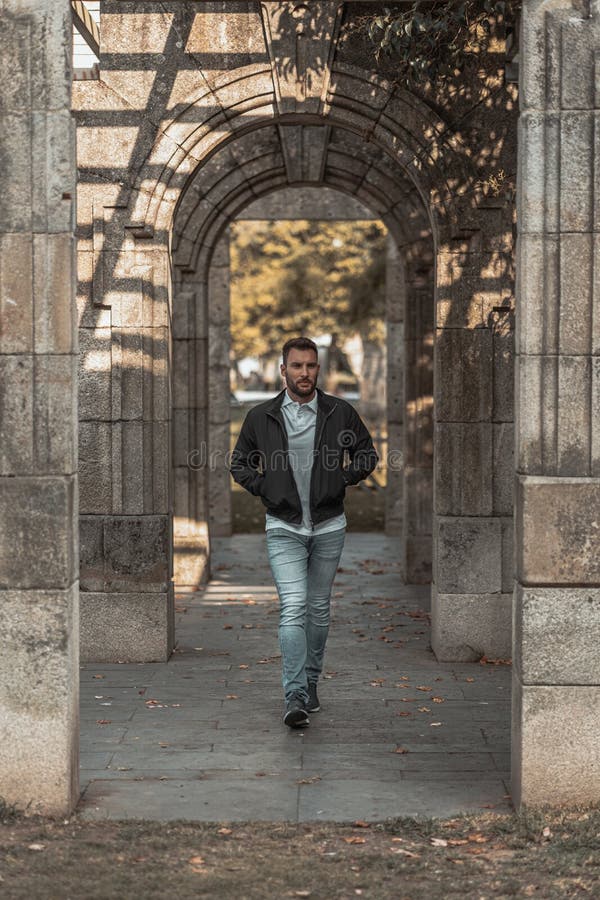 Cool and Attractive Slovenian Man Walking between the Old Arch of a ...