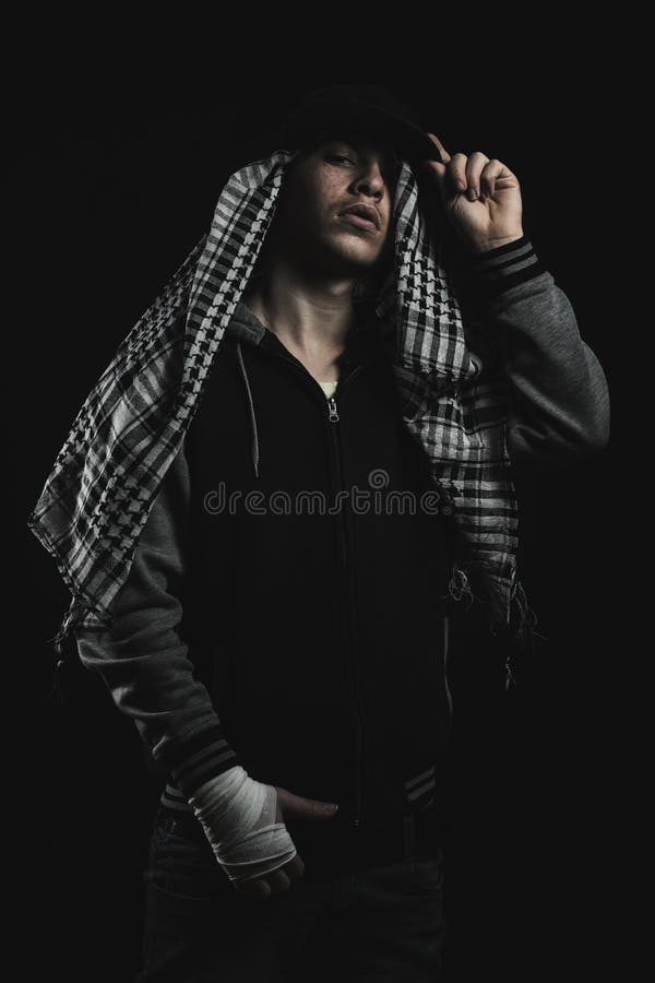 Cool Boy in Hip-hop Style Put Cap on Head with Lowered Scarf Stock ...