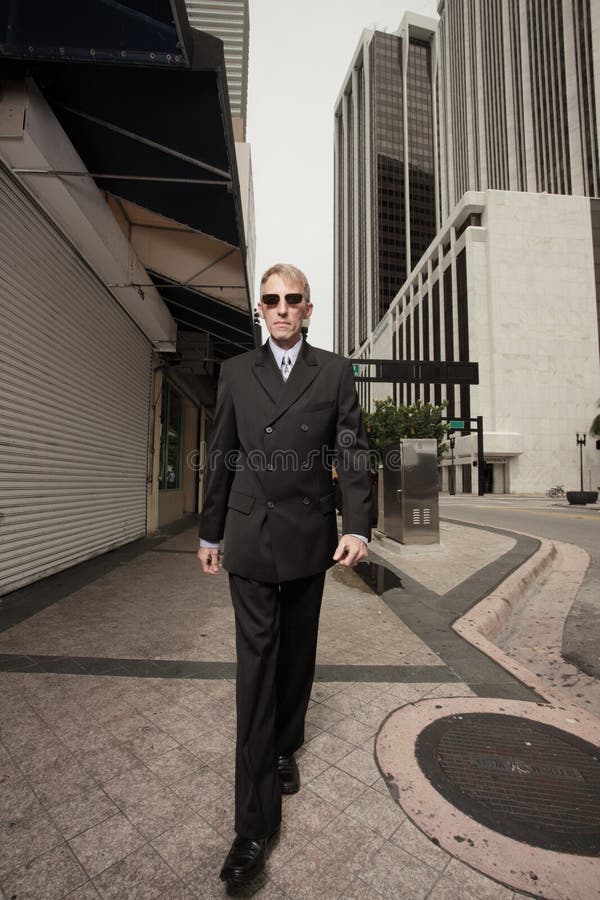 Cool businessman walking stock image. Image of businessman - 9984203