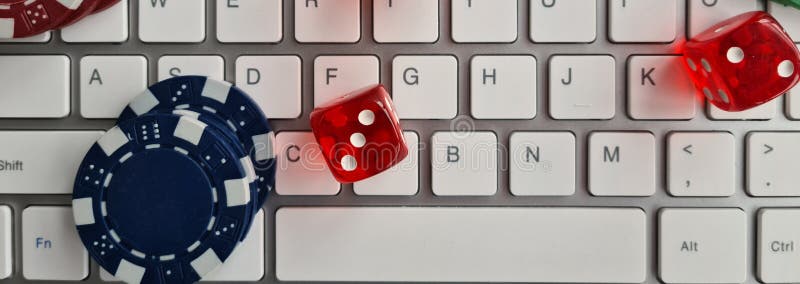 Cool Casino Chips and Dice on Laptop Computer Keyboard Stock Image ...