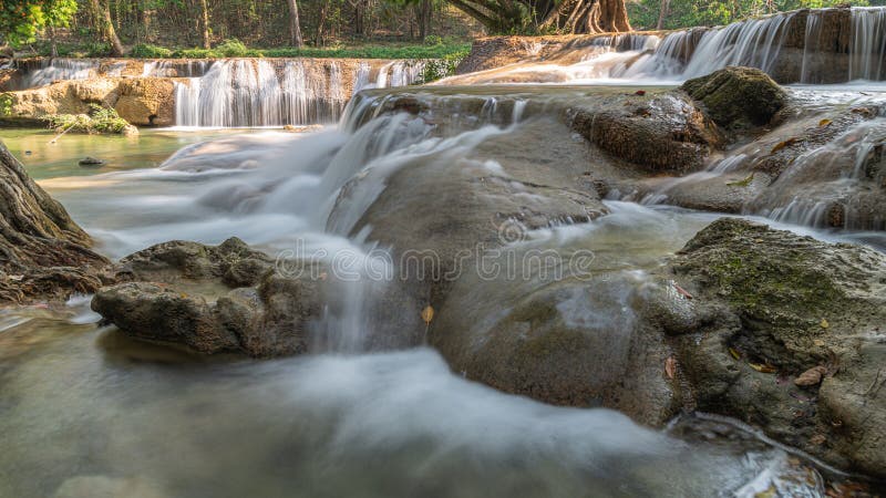 A Cool, Clear Waterfall Flows Over Layers of Rocks Stock Photo - Image ...