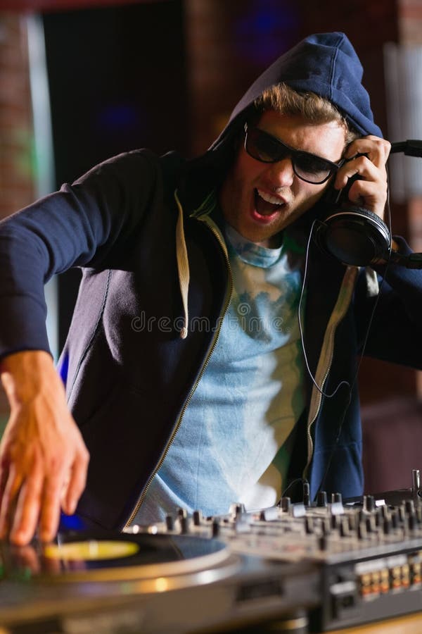 Cool dj spinning the decks stock photo. Image of club - 48995476
