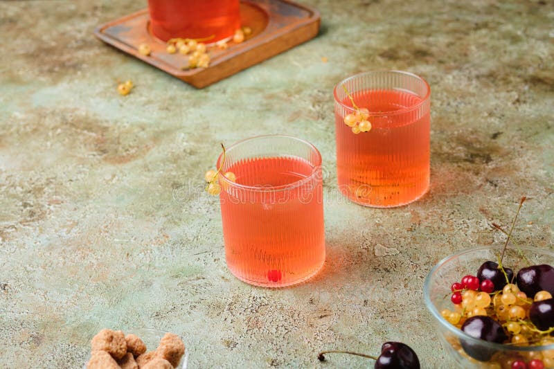 Cool Drink, Compote of Various Berries in Glasses with Ice on a Green ...