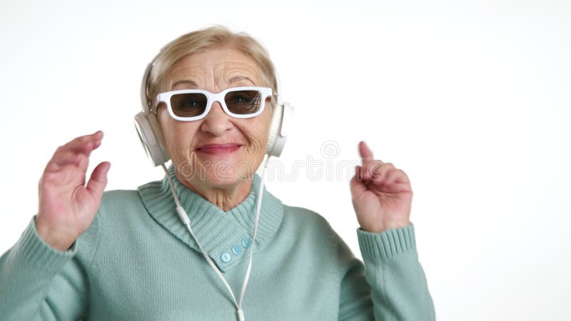 Cool Granny In Headphones And Stylish Sunglasses Dancing Having Fun