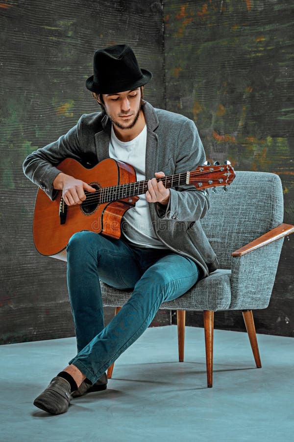 Cool Guy with Hat Playing Guitar on Gray Background Stock Image - Image ...