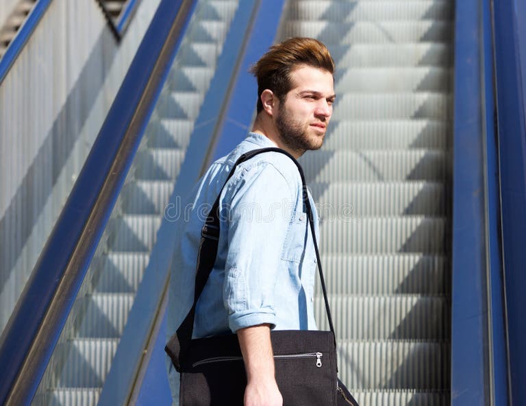 Cool Guy Standing on Escalator Stock Image - Image of full, beard: 52341607