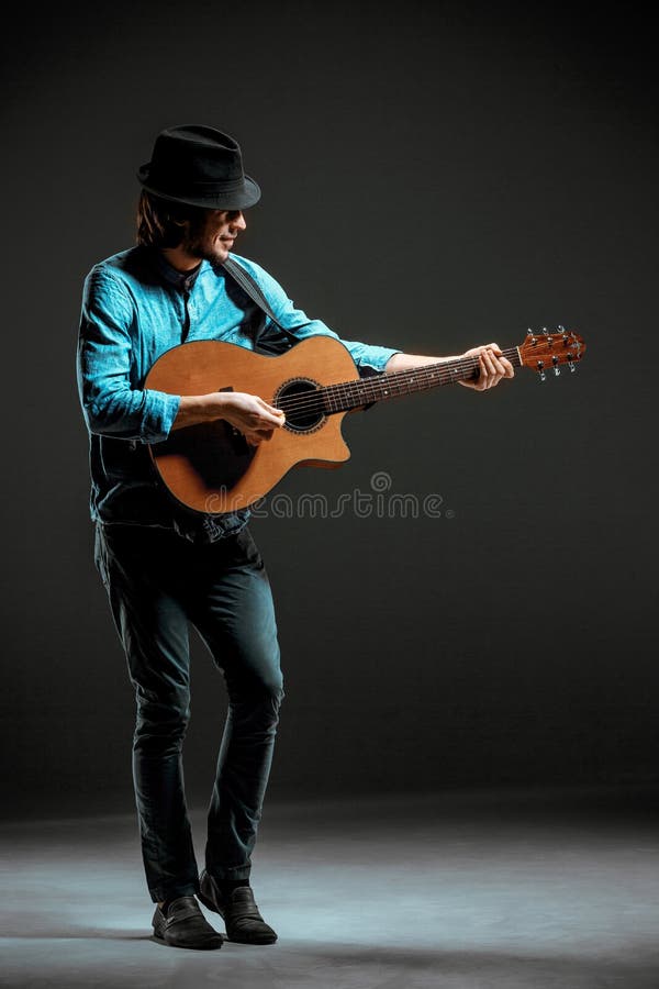 Man standing with guitar. stock image. Image of instrument - 16550895