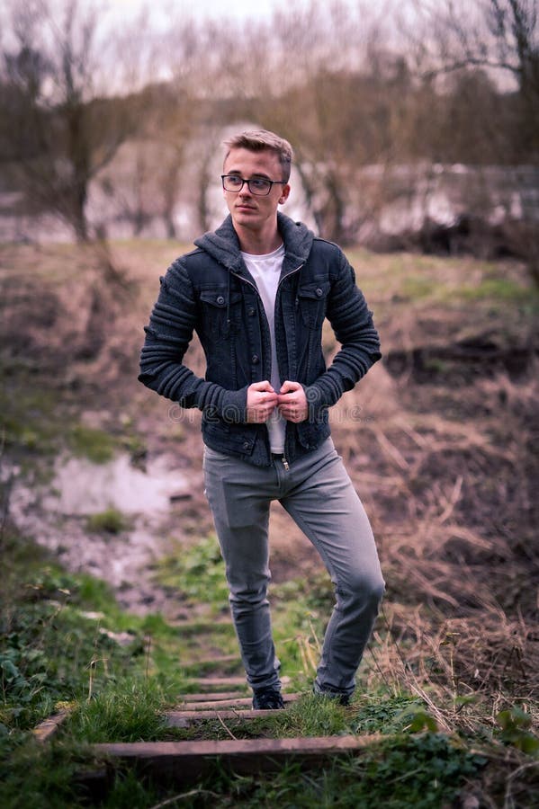Cool Handsome Caucasian Male in the Woods, Vertical Shot Stock Photo ...