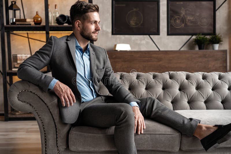 Cool and Handsome. Good Looking Young Man in Full Suit Sitting on the ...