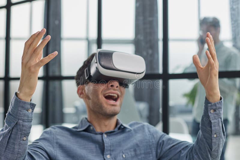 Cool Handsome Man Put on Virtual Reality Goggles for the First Time in ...