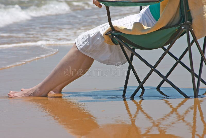 Cool heels stock photo. Image of shore, ocean, deckchair - 324928