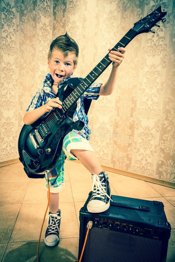 Cool Little Boy Posing with Electric Guitar. Stock Image - Image of ...
