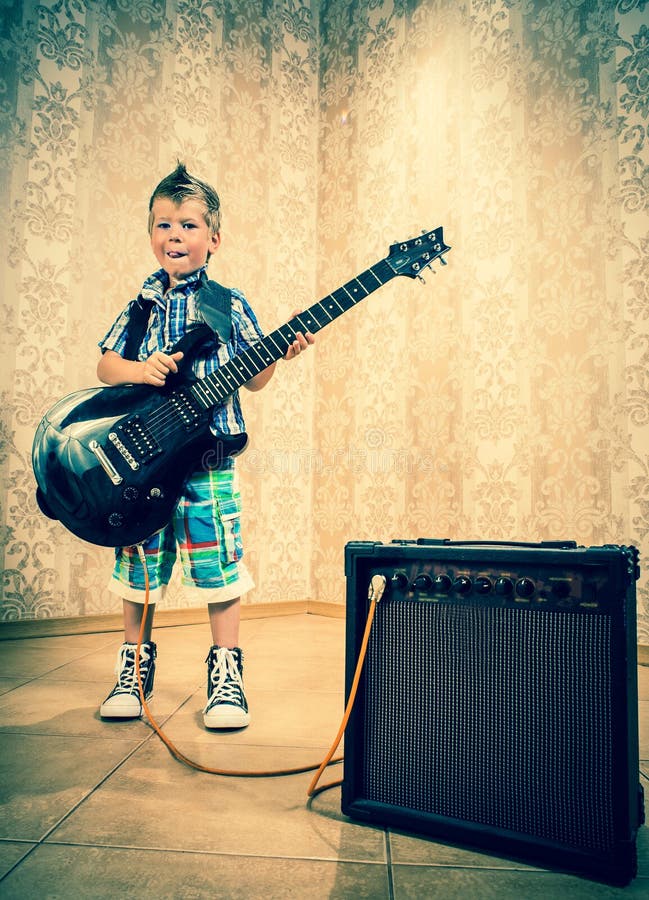 Cool Little Boy Posing with Electric Guitar. Stock Photo - Image of ...