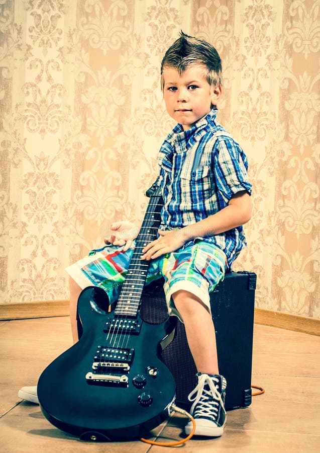 Cool Little Boy Posing with Electric Guitar. Stock Photo - Image of ...