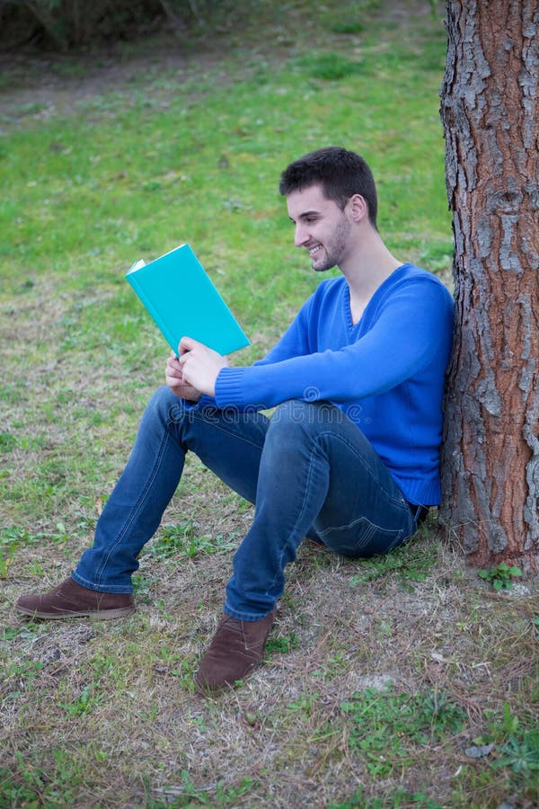 Cool Man Reading a Book Next a Tree Stock Photo - Image of happy ...