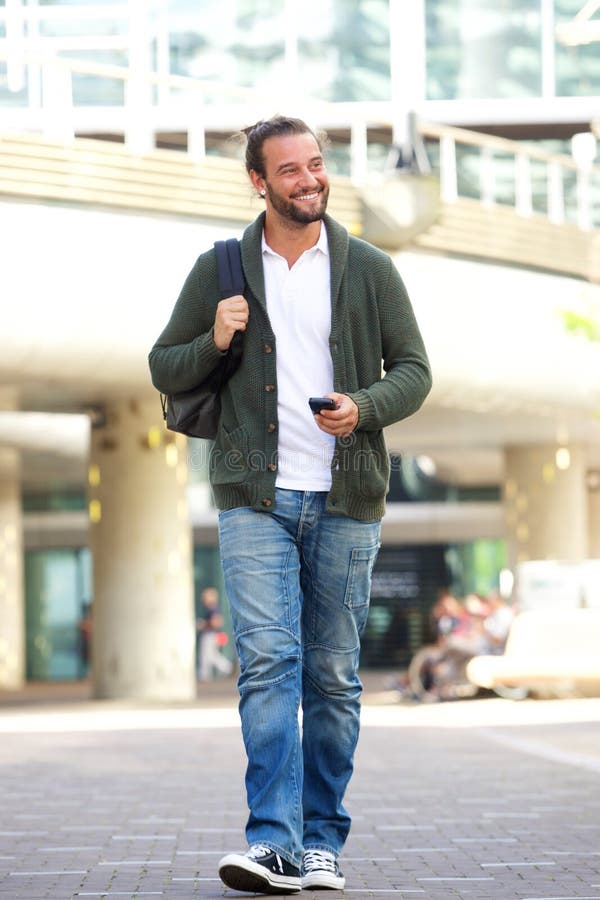 Cool Man Walking with Mobile Phone and Bag Stock Image - Image of enjoy ...
