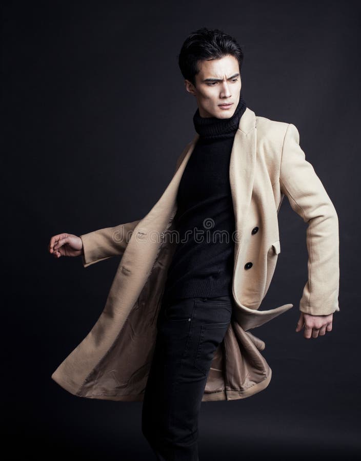 Cool Real Young Man in Coat on Black Background Posing Stock Photo ...