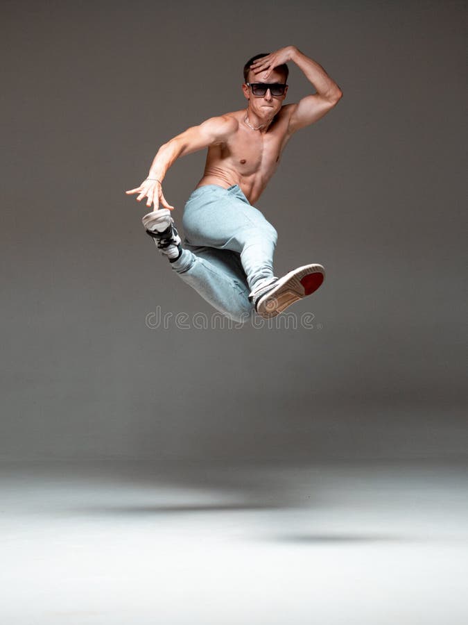 Cool Young Guy Breakdancer Dancing Hip-hop and Jump in Studio. Dance ...