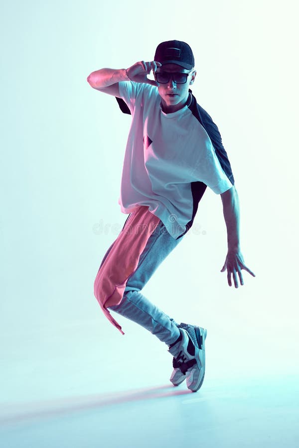 Cool Young Guy Dance Contemporary Dance in Studio in Neon Light. Break ...