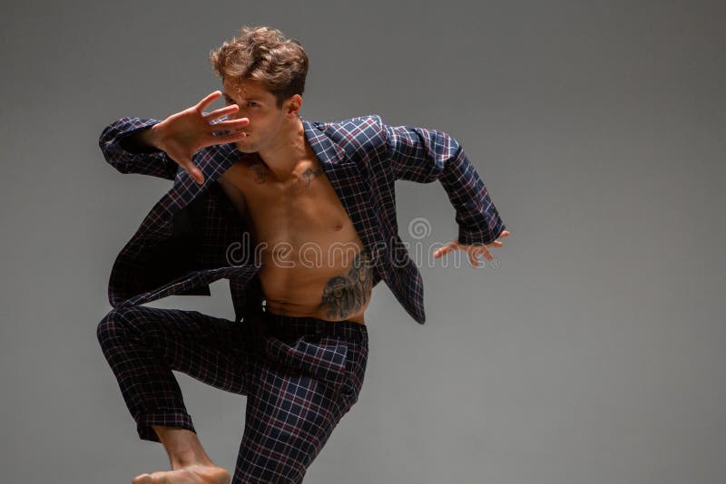Cool Young Guy Dancer in Suit Dancing Modern Expressive Dance in Studio ...