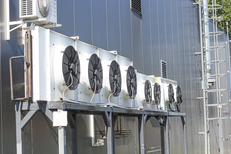 Cooling Fans Hang on the Wall of the Building Stock Photo - Image of ...