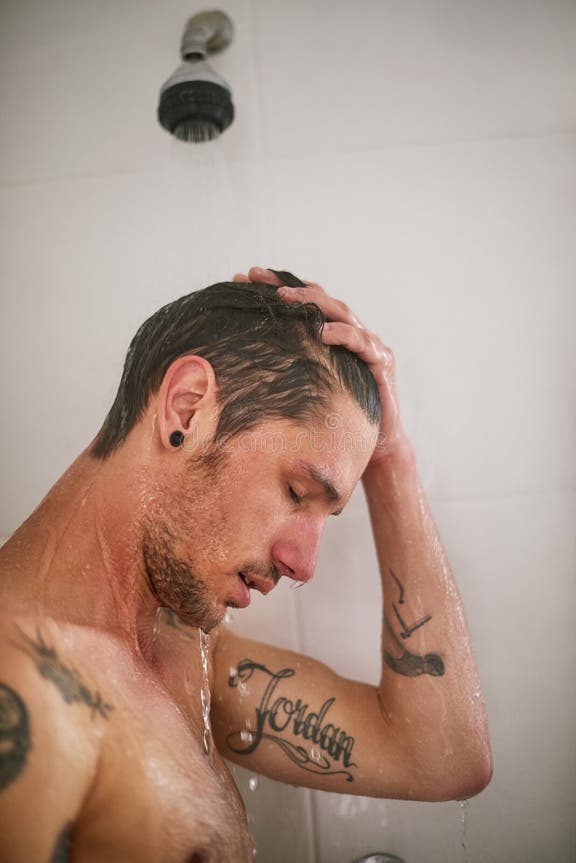 Cooling Off in the Shower. a Handsome Young Man Having a Shower. Stock ...