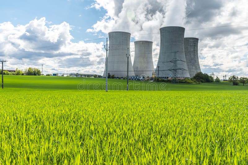 Cooling Tower of Nuclear Power Plant Behind Green Grass. Atomic Energy ...