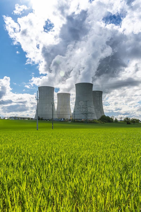 Cooling Tower of Nuclear Power Plant Behind Green Grass. Atomic Energy ...