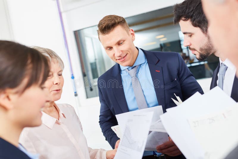 Cooperation in the Business Team in the Office Stock Image - Image of ...