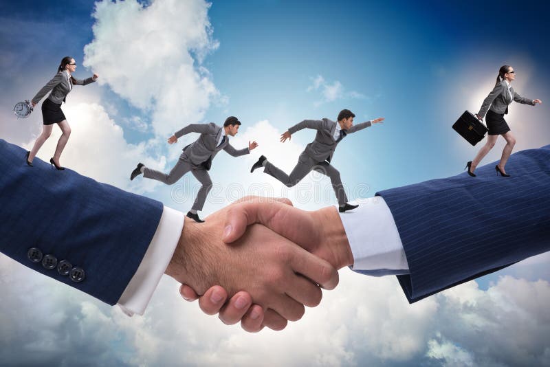 The Cooperation Concept with People Running on Handshake Stock Photo ...