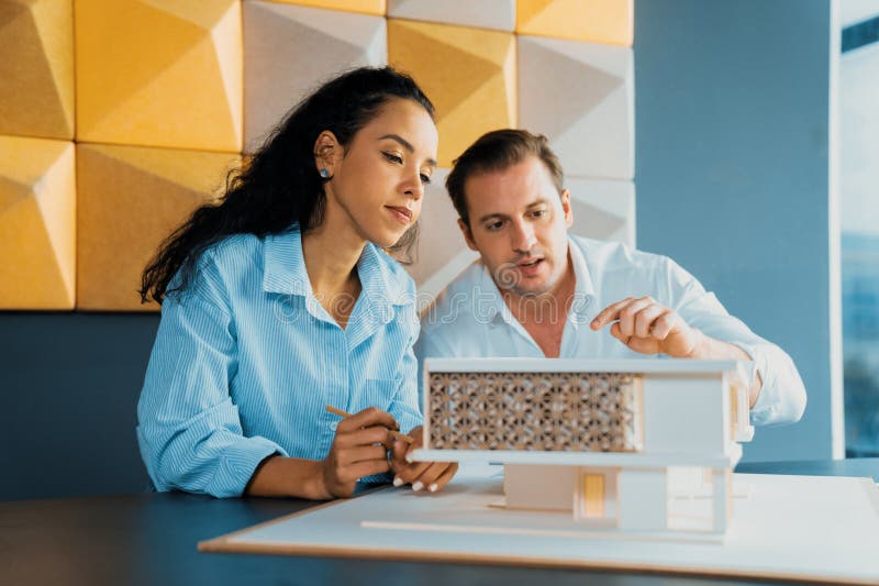 Cooperative Engineer Team Working Together To Measure House Model ...