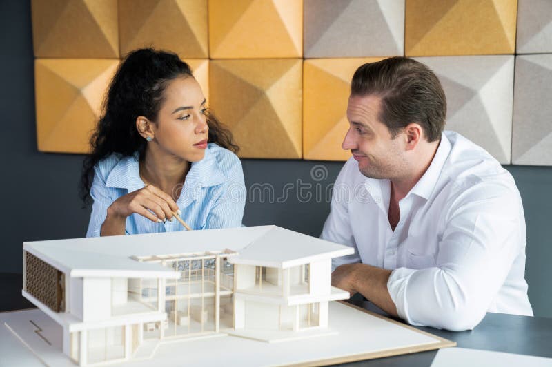 Cooperative Engineer Team Working Together To Measure House Model ...