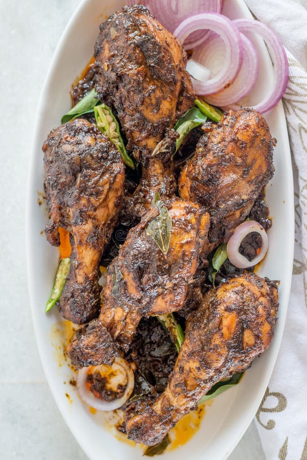 Coorg Style Fried Chicken Legs Recipe on White Plate Stock Image ...