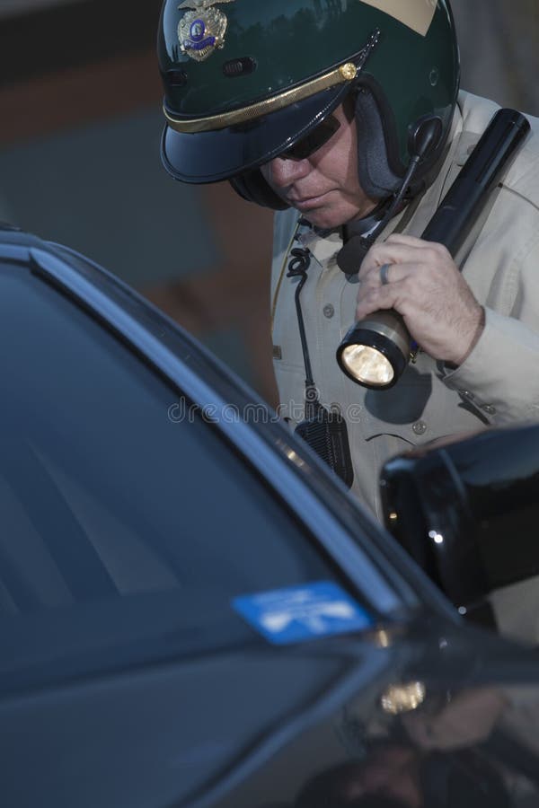 Cop with Flashlight Investigating Car Stock Image - Image of government ...