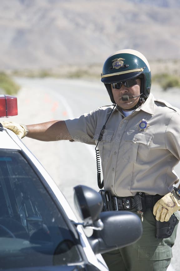 Cop Standing by His Car stock photo. Image of road, sunlight - 29651280