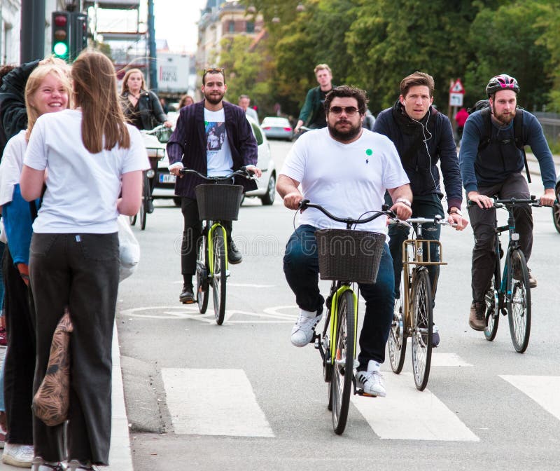 Copenhagen, Denmark, August, 17: a Group of Men Ride Bicycles in ...