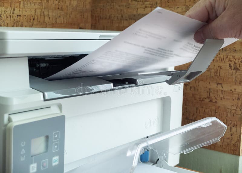 Copier Printer, a Man Makes a Copy of a Sheet Document in the Printer ...